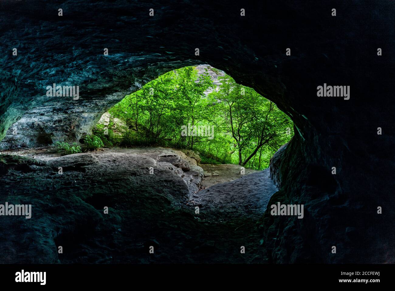 View from a rock cave Stock Photo - Alamy