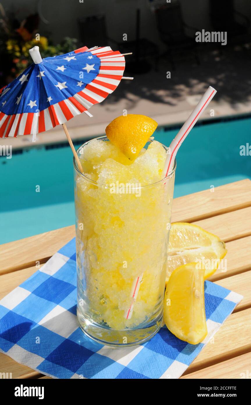 A tall glass of frozen lemonade by the pool Stock Photo - Alamy
