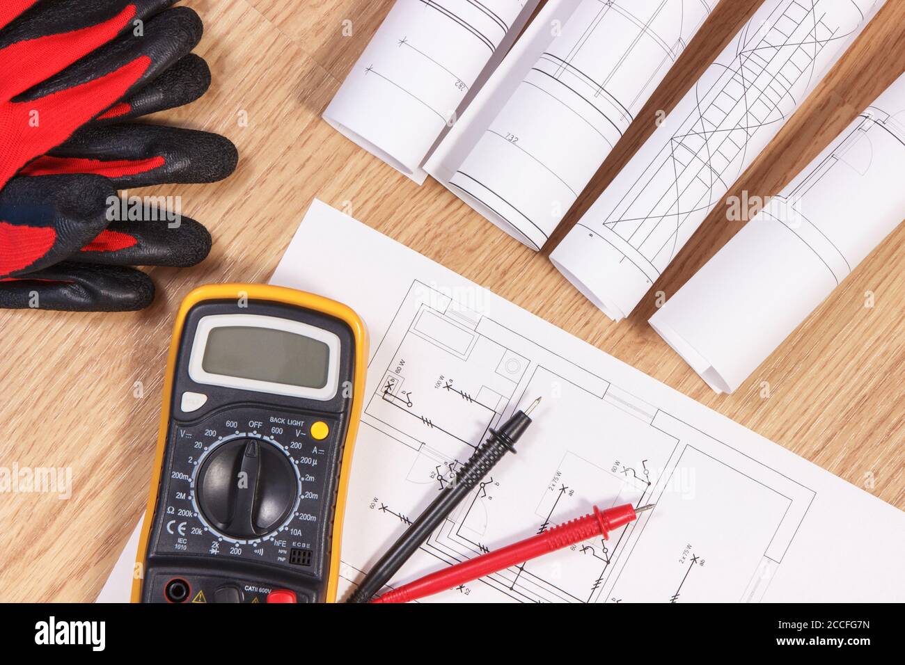 Diagrams and electrical construction drawings, protective gloves and ...