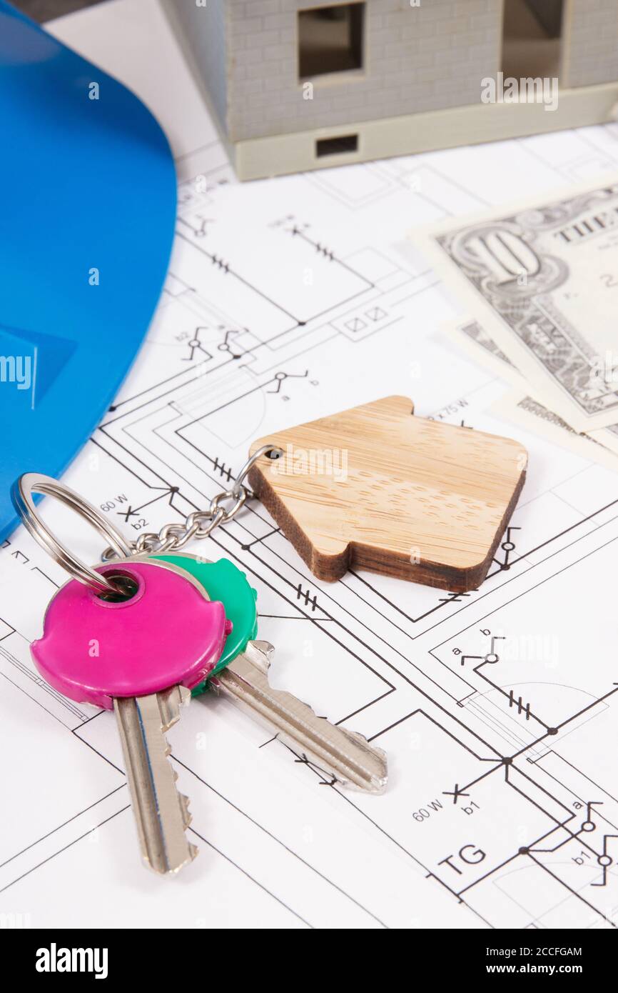 Keys with home shape, currencies dollar and small house under ...