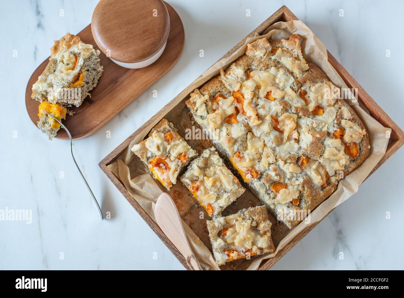home made poppy seed pie with apricot and crumble Stock Photo - Alamy