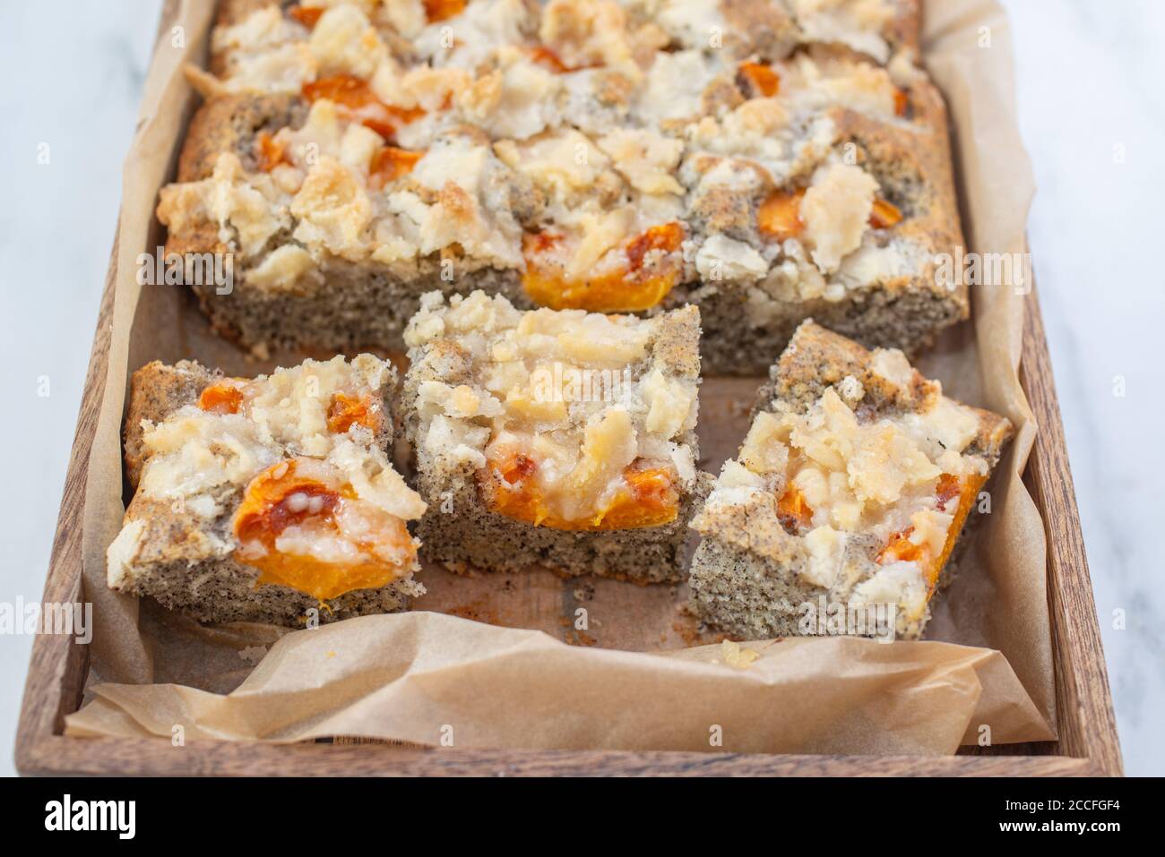 home made poppy seed pie with apricot and crumble Stock Photo - Alamy