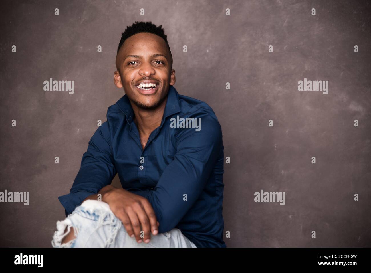 african stock photo of black gentlemen in smart clothes in studio ...