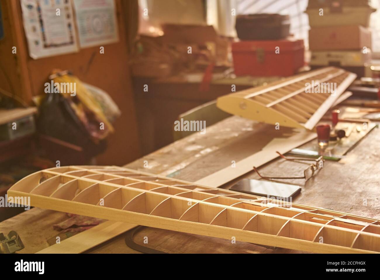 The wooden wing of a radio-controlled aircraft on the desktop in the ...