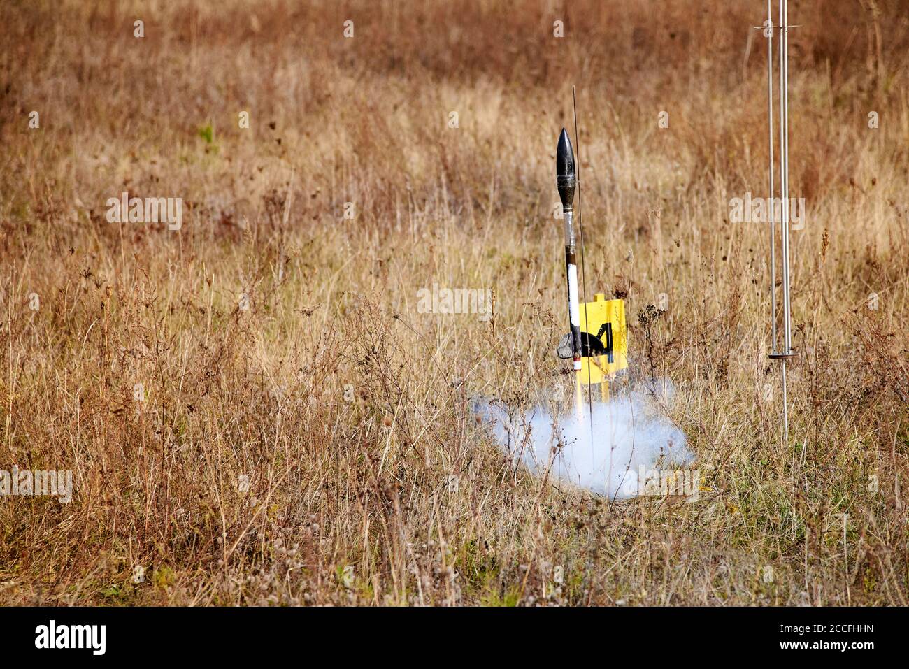 The beginning of the flight of a rocket model in the field in the fall ...