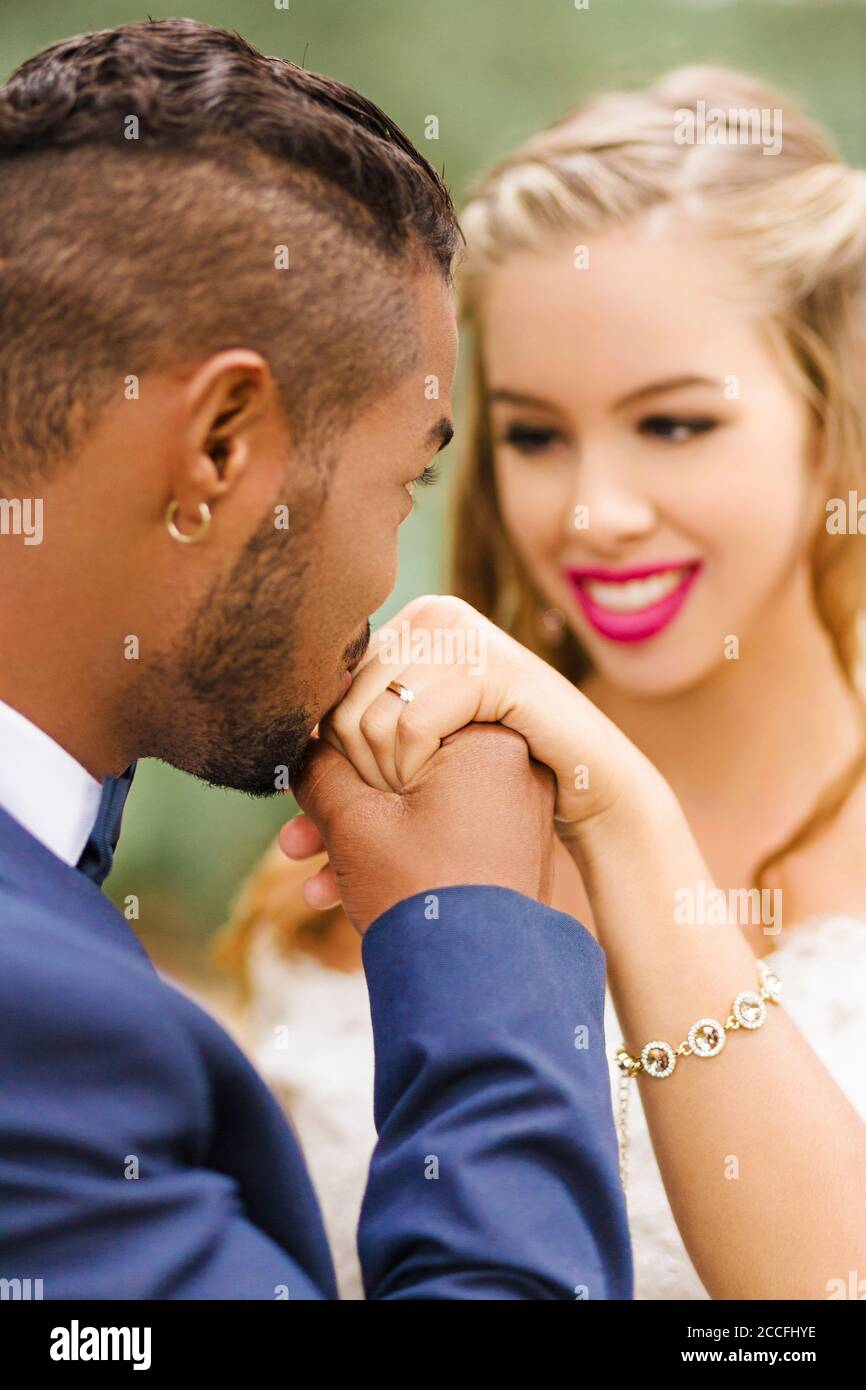 Wedding, newlyweds, happy, diversity, love, hand kiss, bridal jewelry ...