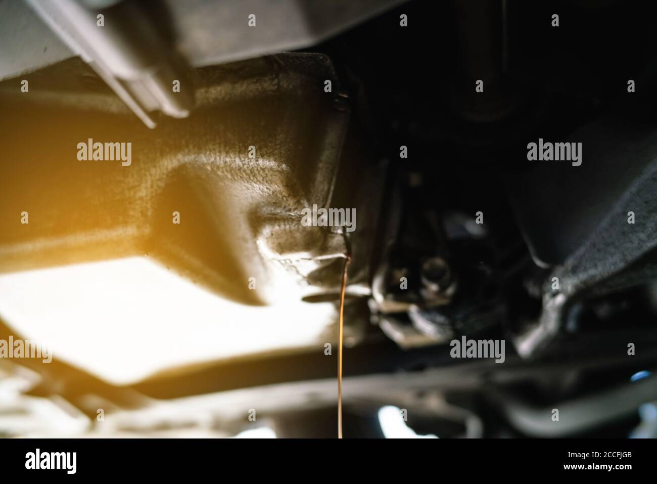 Oil lubricant refill close up of engine under car Stock Photo - Alamy