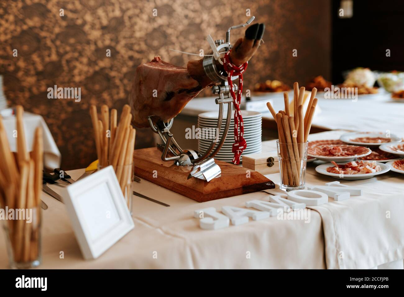 Chef cut a slice of traditional spanish jamon Stock Photo - Alamy