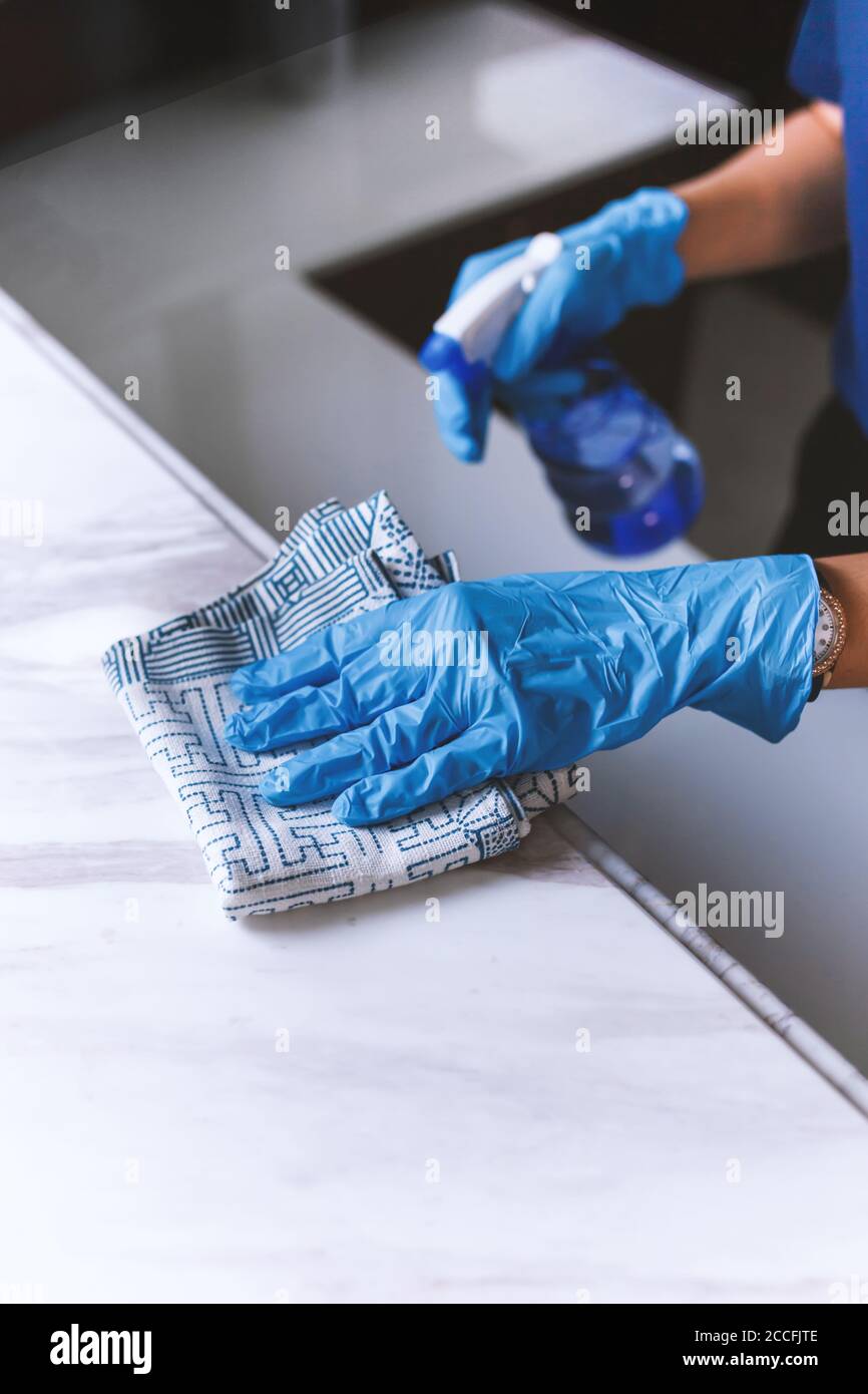 Cleaning home table sanitizing kitchen table surface with disinfectant ...