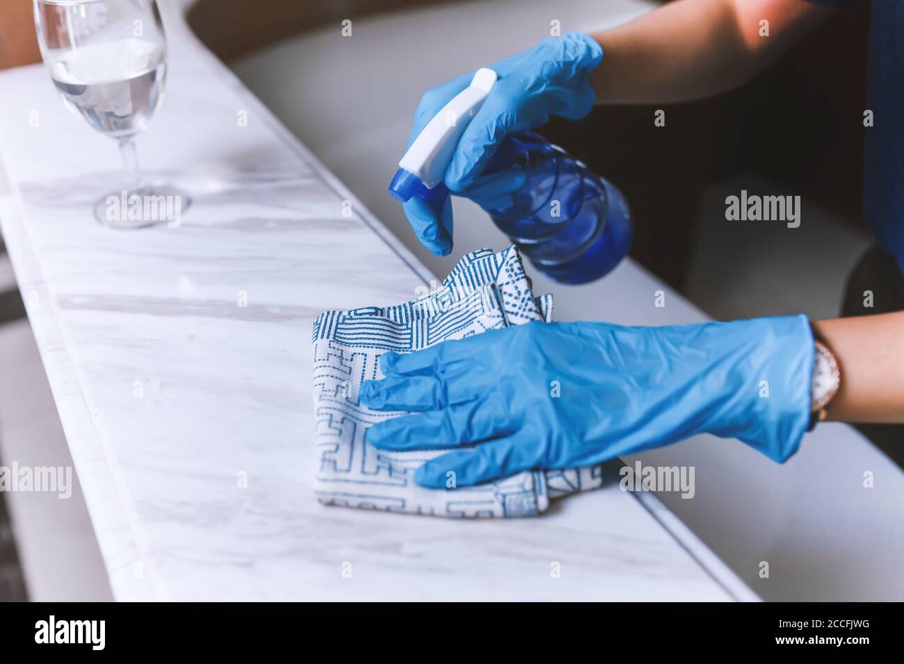 Cleaning home table sanitizing kitchen table surface with disinfectant ...