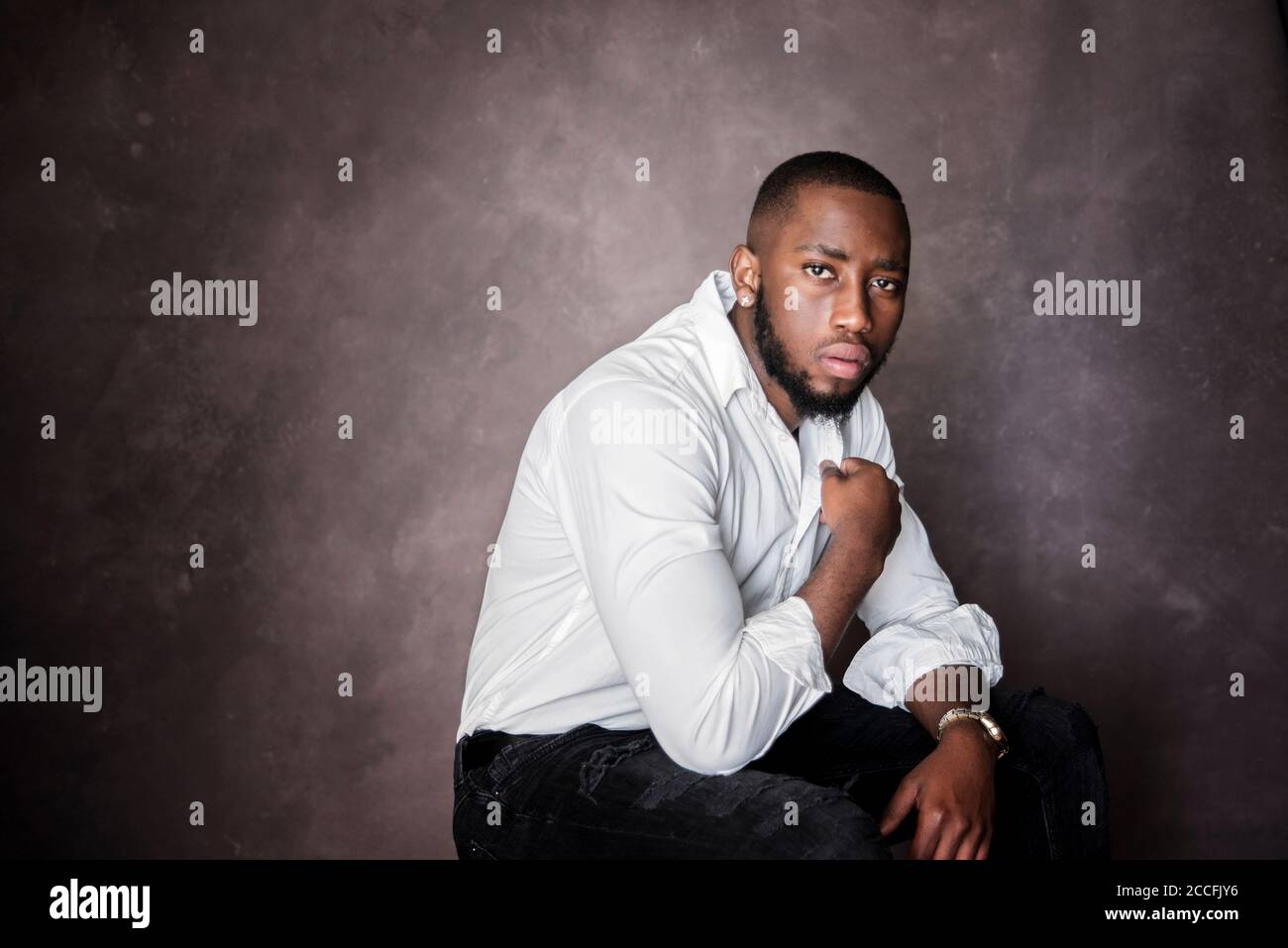 african stock photo of black gentlemen in smart clothes in studio ...