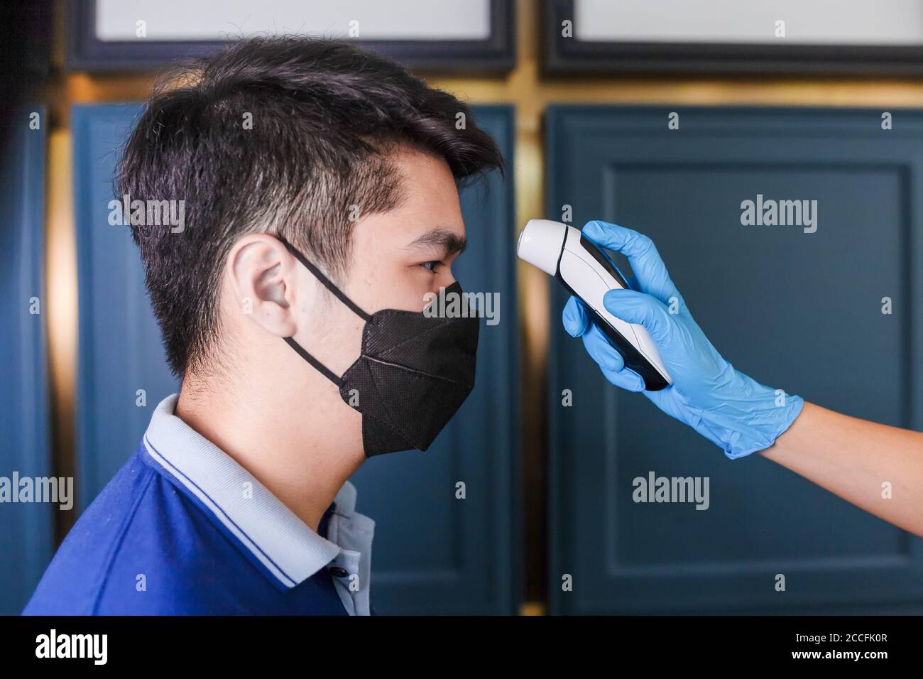 An infrared thermometer Scan Fever And Symptoms of Coronavirus Stock ...