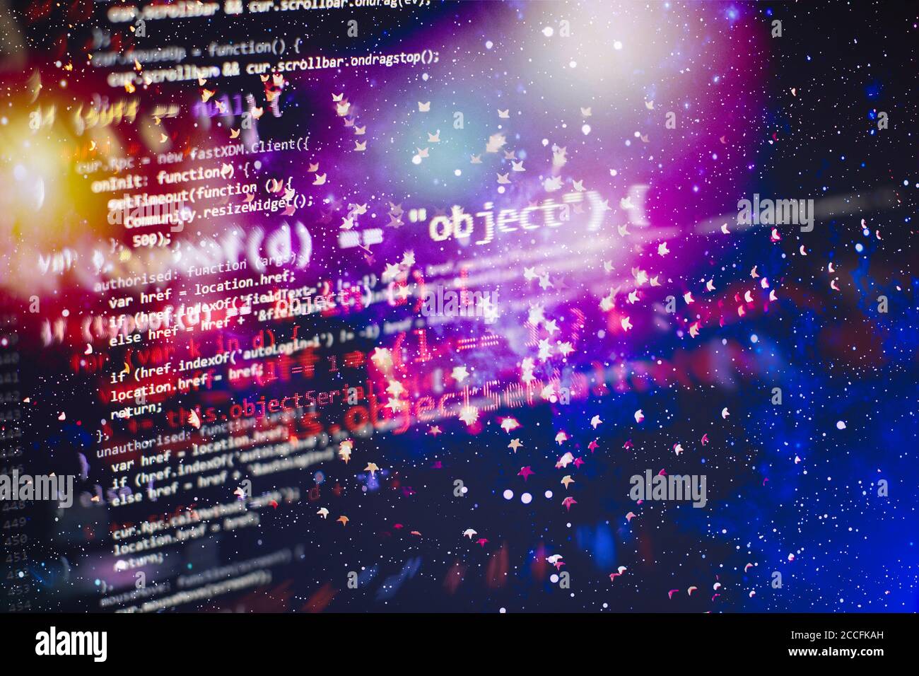 Programmer working in a software develop company office. Digital binary data on computer screen ...