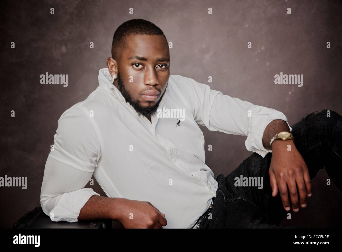 african stock photo of black gentlemen in smart clothes in studio ...