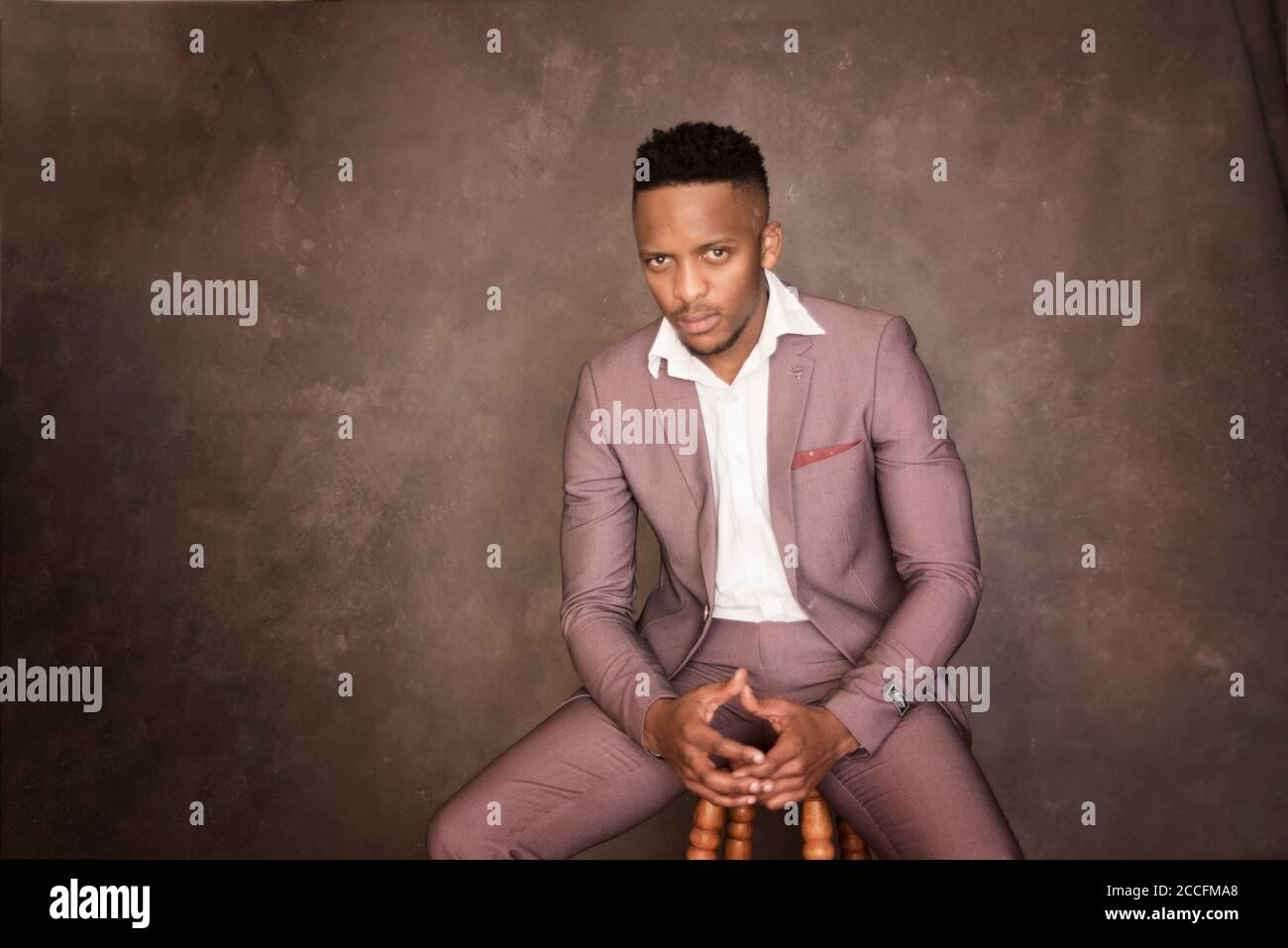 african stock photo of black gentlemen in smart clothes in studio ...