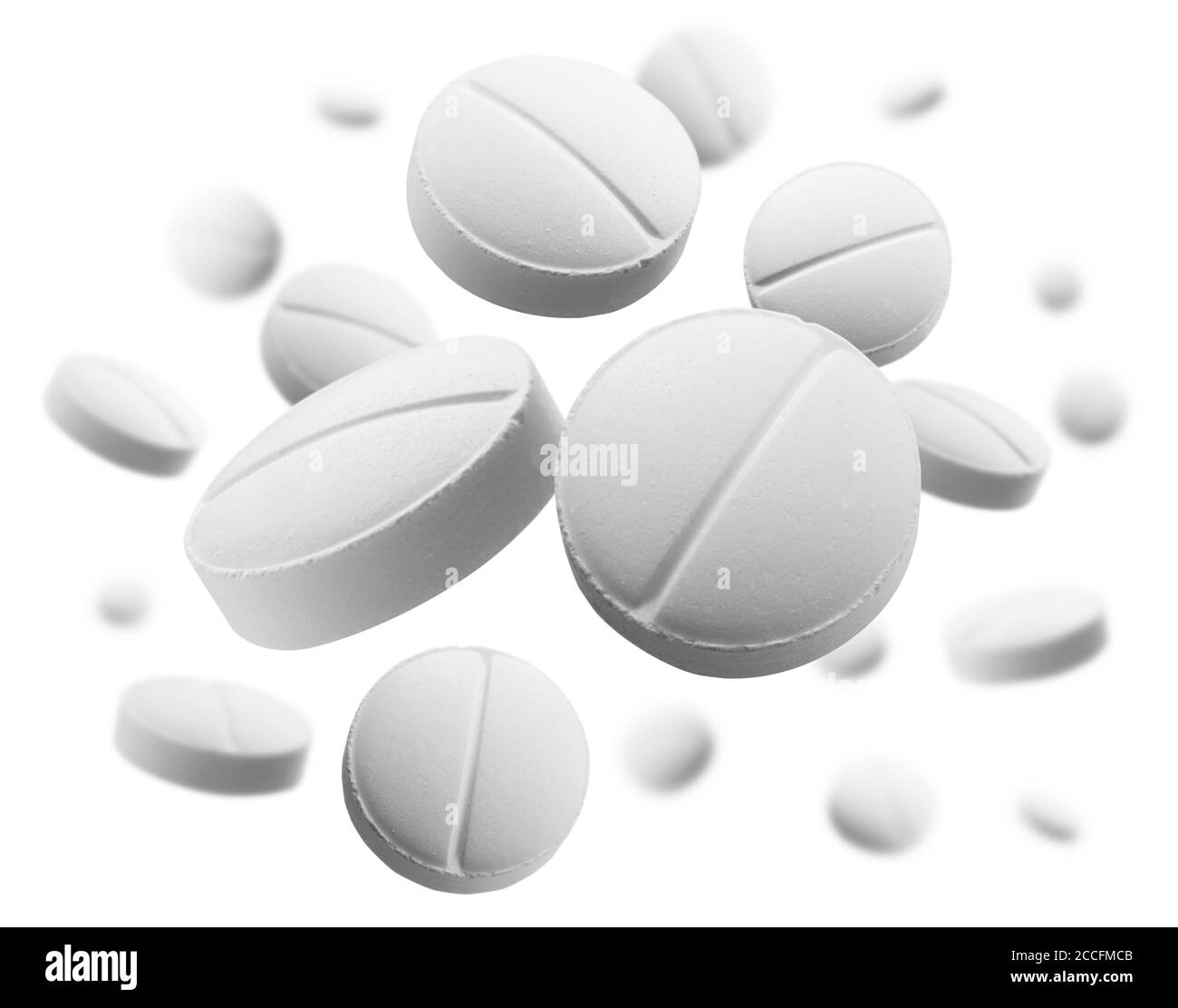 White round tablets levitate on a white background Stock Photo - Alamy