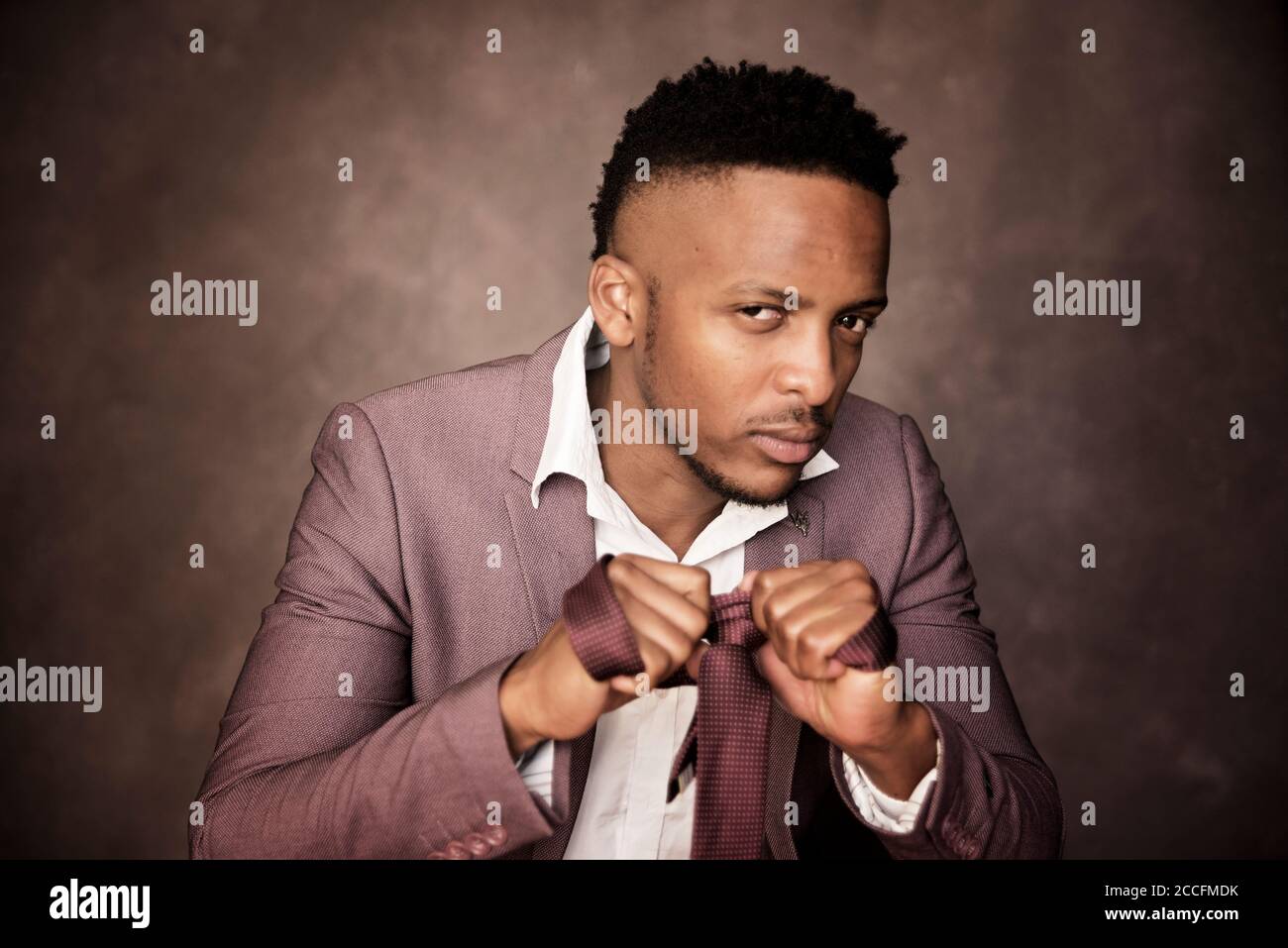 african stock photo of black gentlemen in smart clothes in studio ...