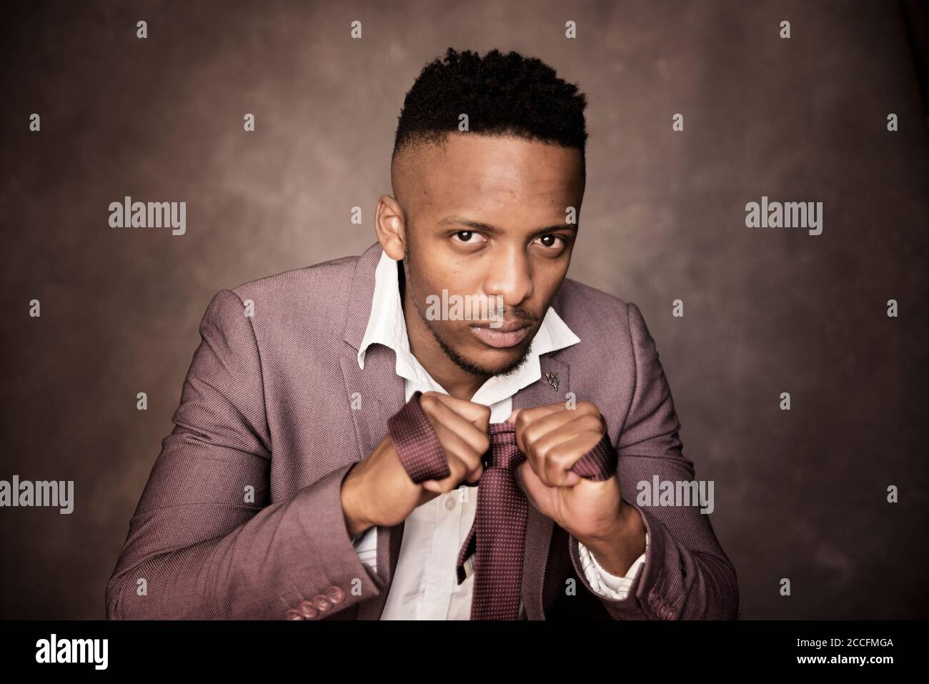 african stock photo of black gentlemen in smart clothes in studio ...