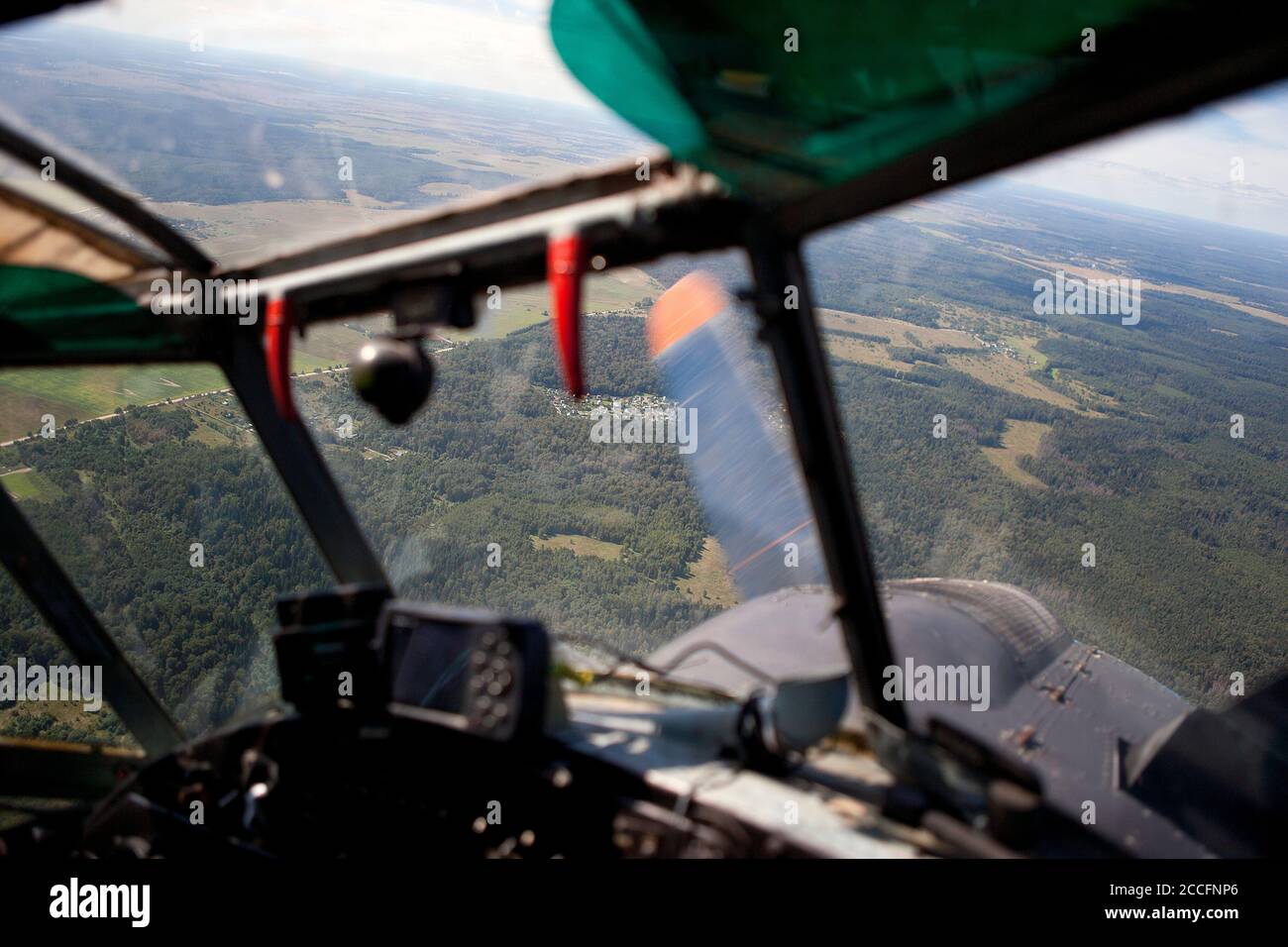 Aerial angled view from a cockpit of vintage aircraft, focus in the ...