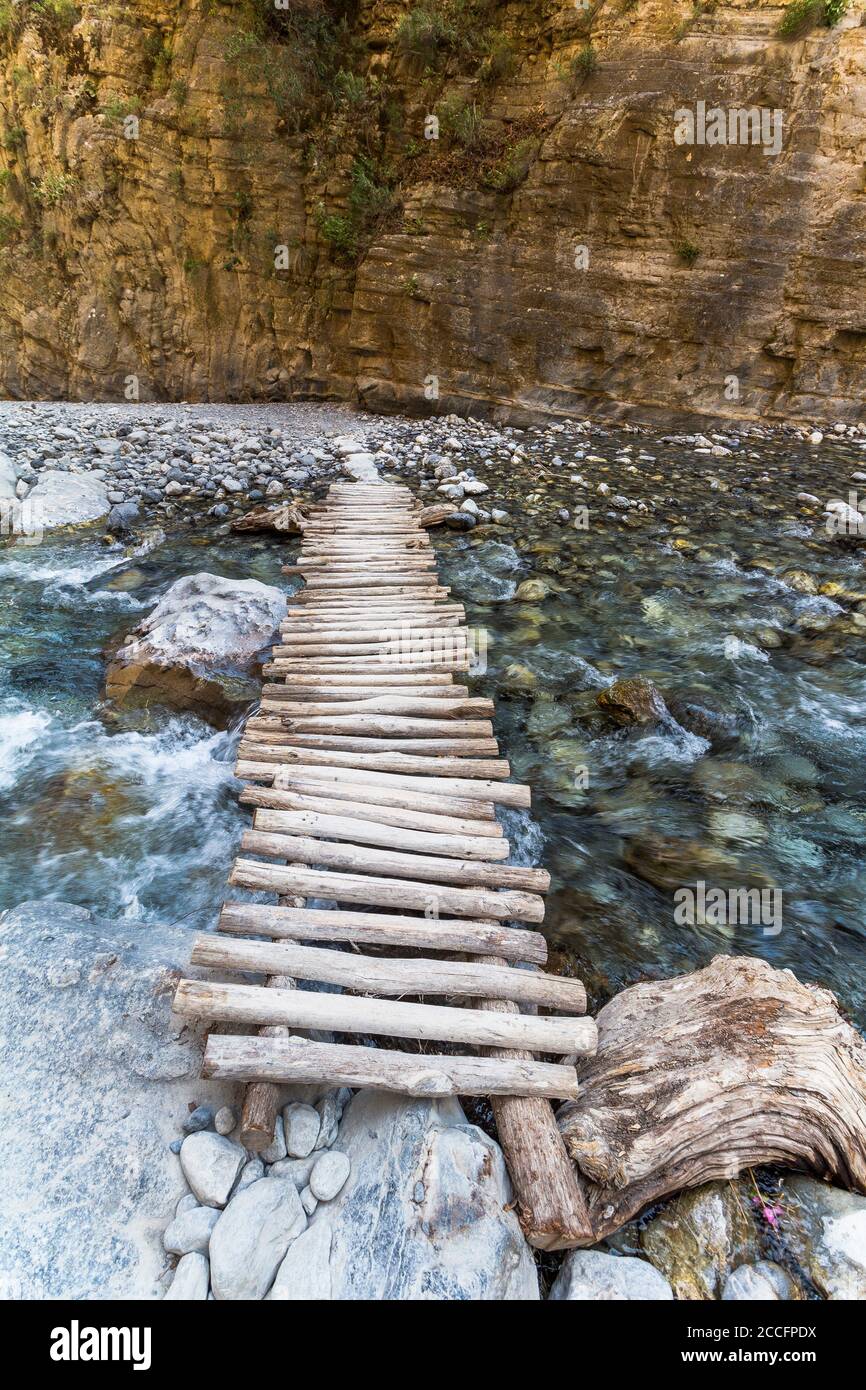 Wooden footbridge over river in samaria gorge hi-res stock photography ...