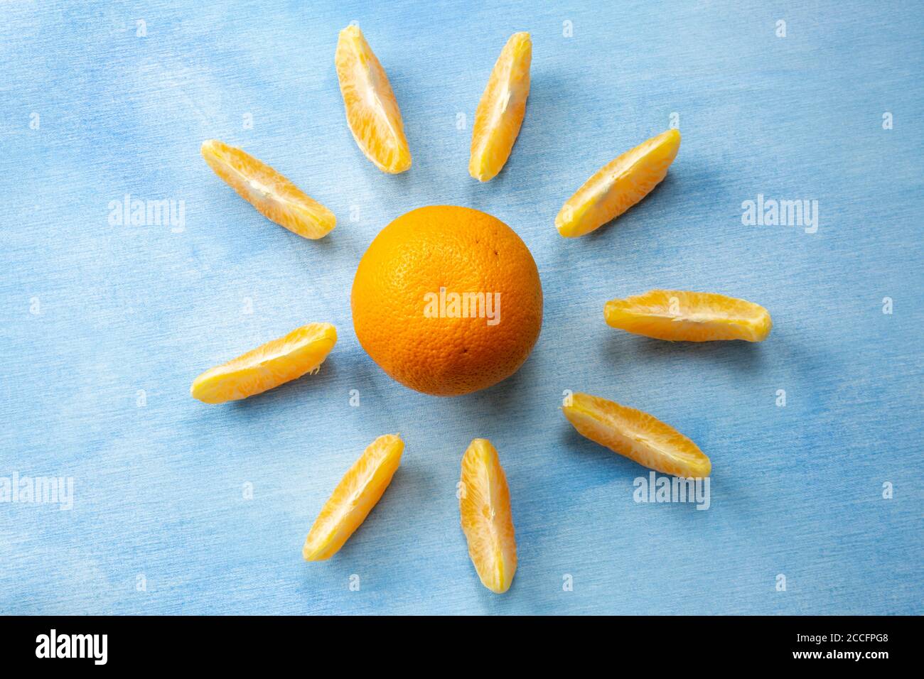 Vegetarian and Healthy Concept, sun shaped orange Stock Photo - Alamy