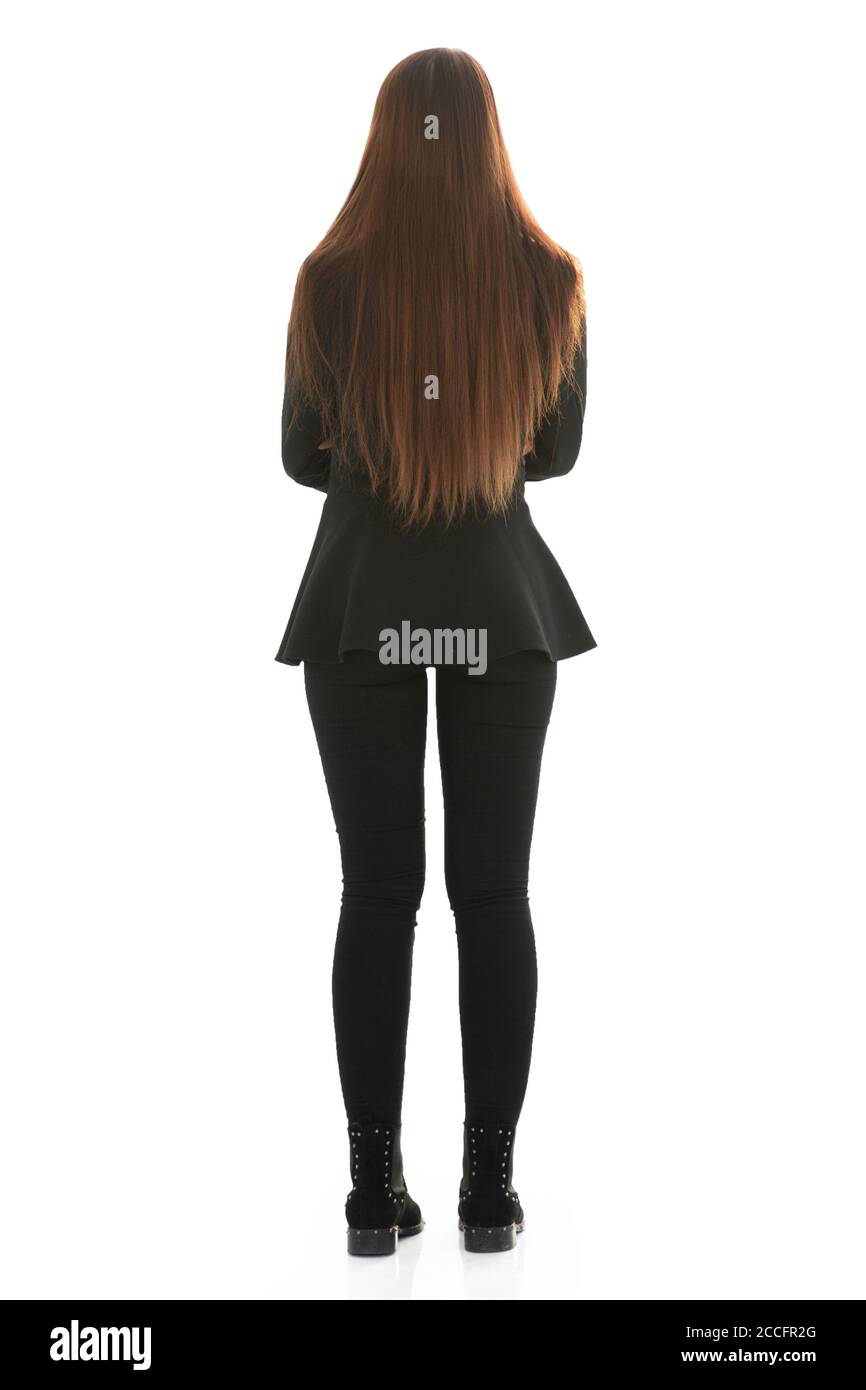 Successful business woman standing back Stock Photo - Alamy