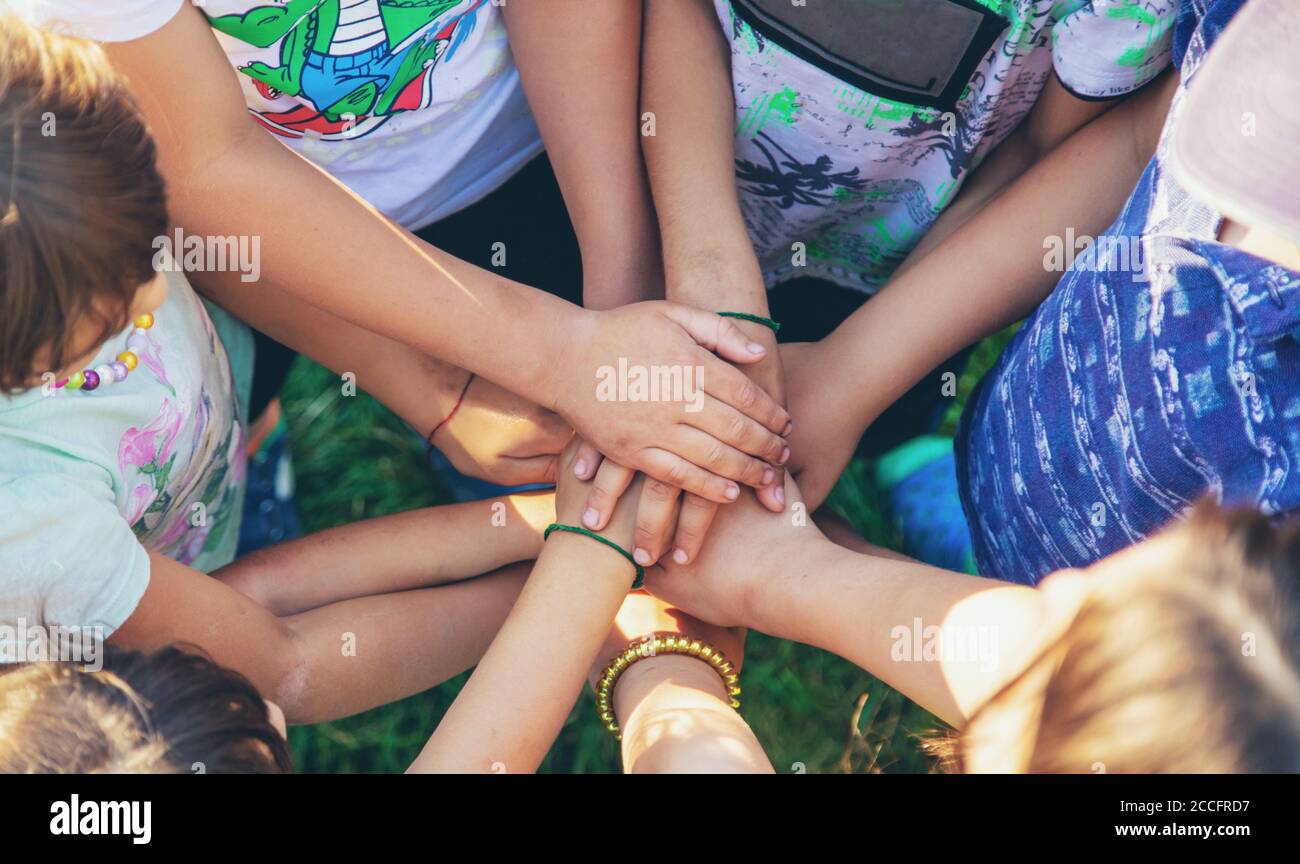 The children put their hands together. Selective focus. people Stock ...