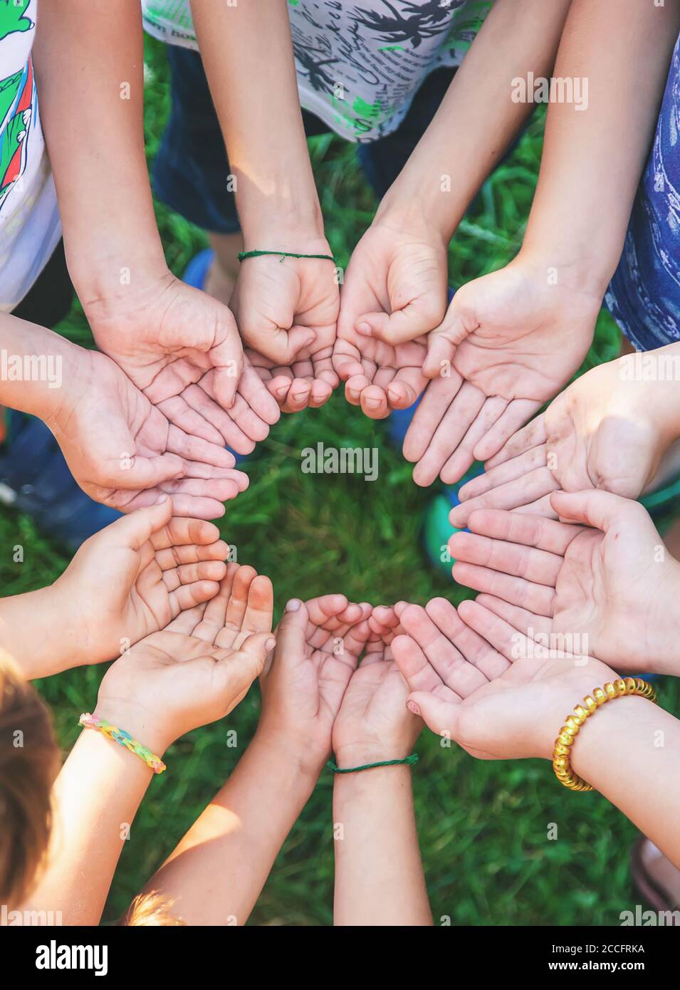 The children put their hands together. Selective focus. people Stock ...