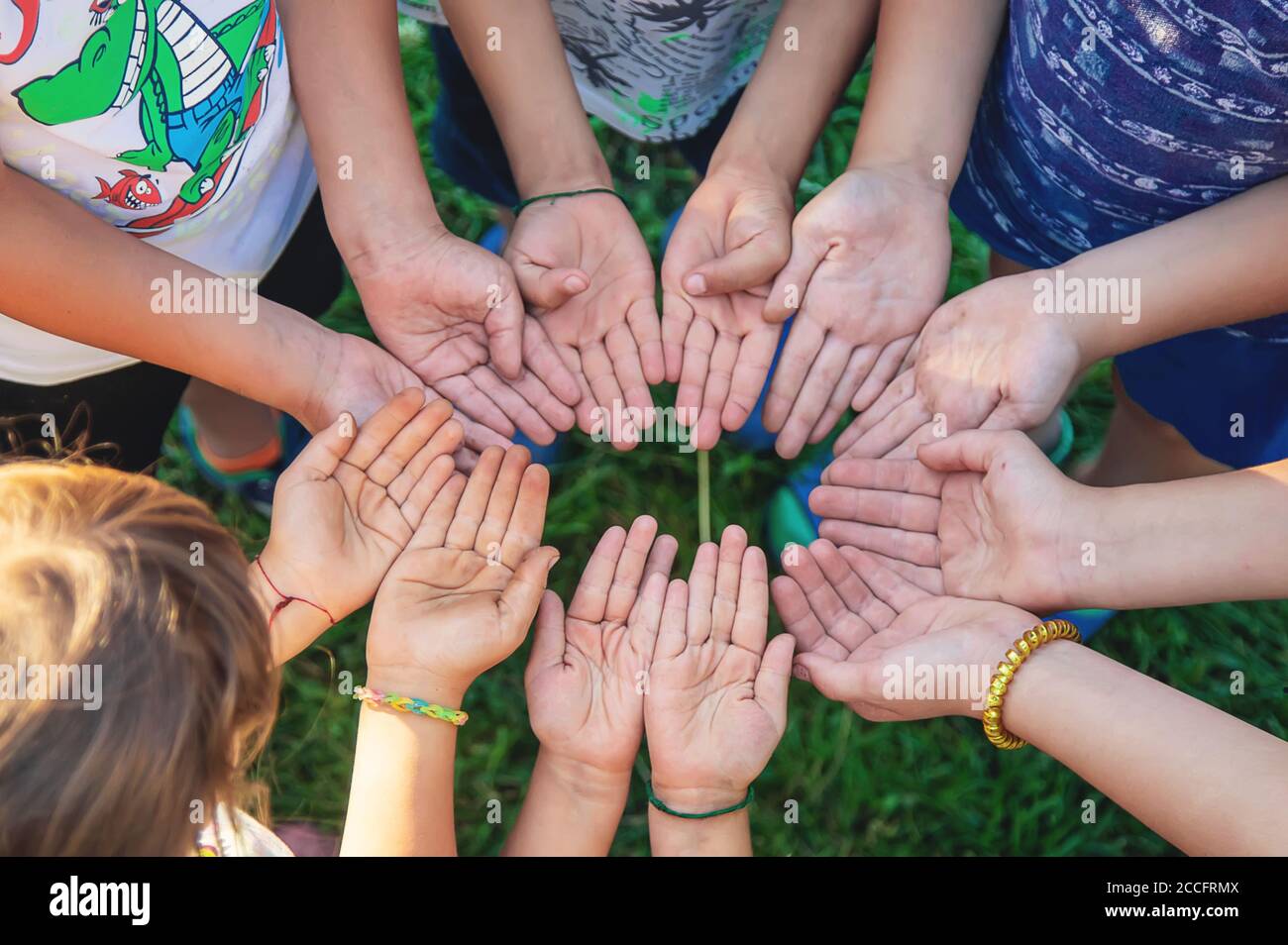 The children put their hands together. Selective focus. people Stock ...