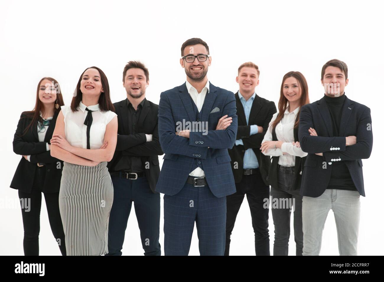 Smiling employees standing around their manager Stock Photo - Alamy