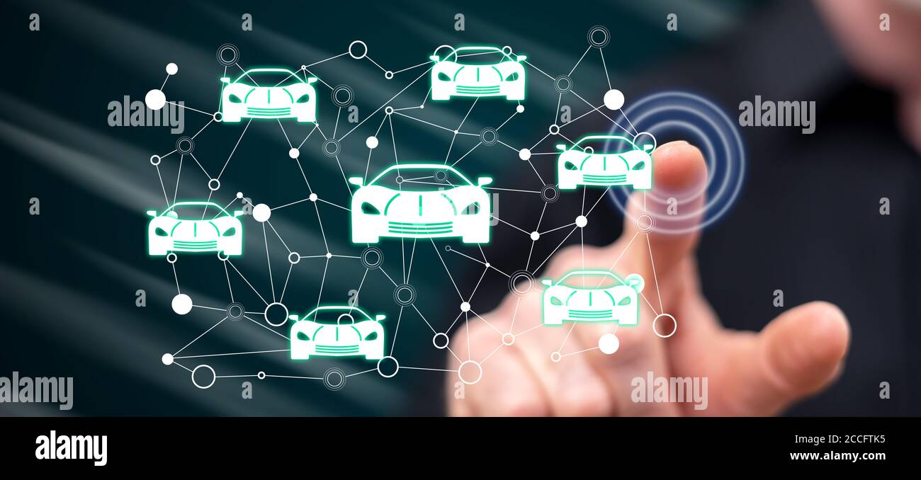 Man touching a smart car concept on a touch screen with his finger ...