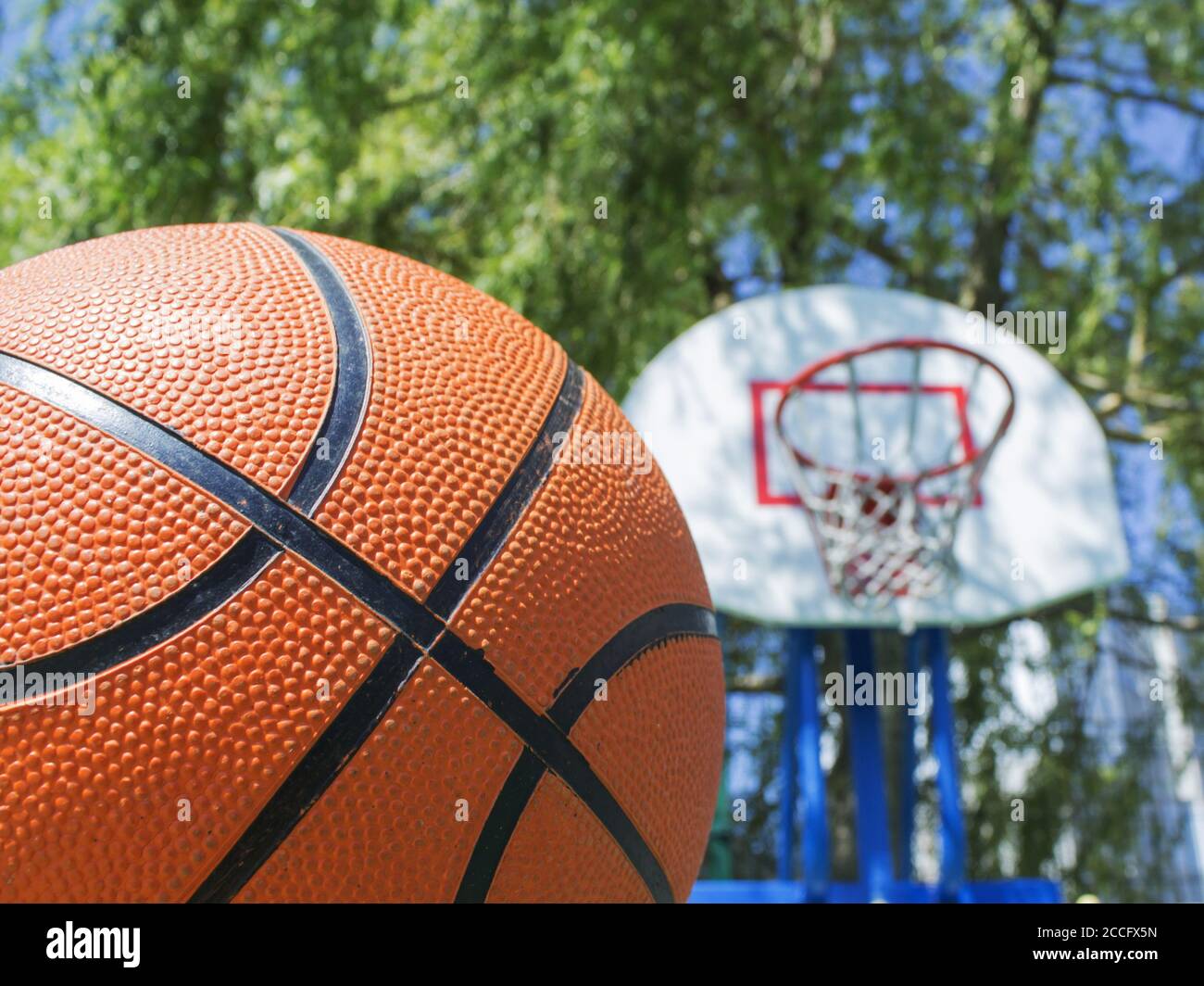 Basketball on a basket background Stock Photo - Alamy