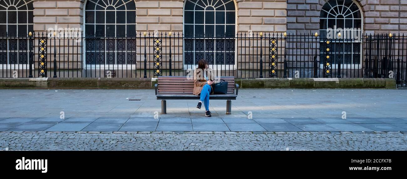 Sitting on the bench exchange flags Liverpool Stock Photo - Alamy
