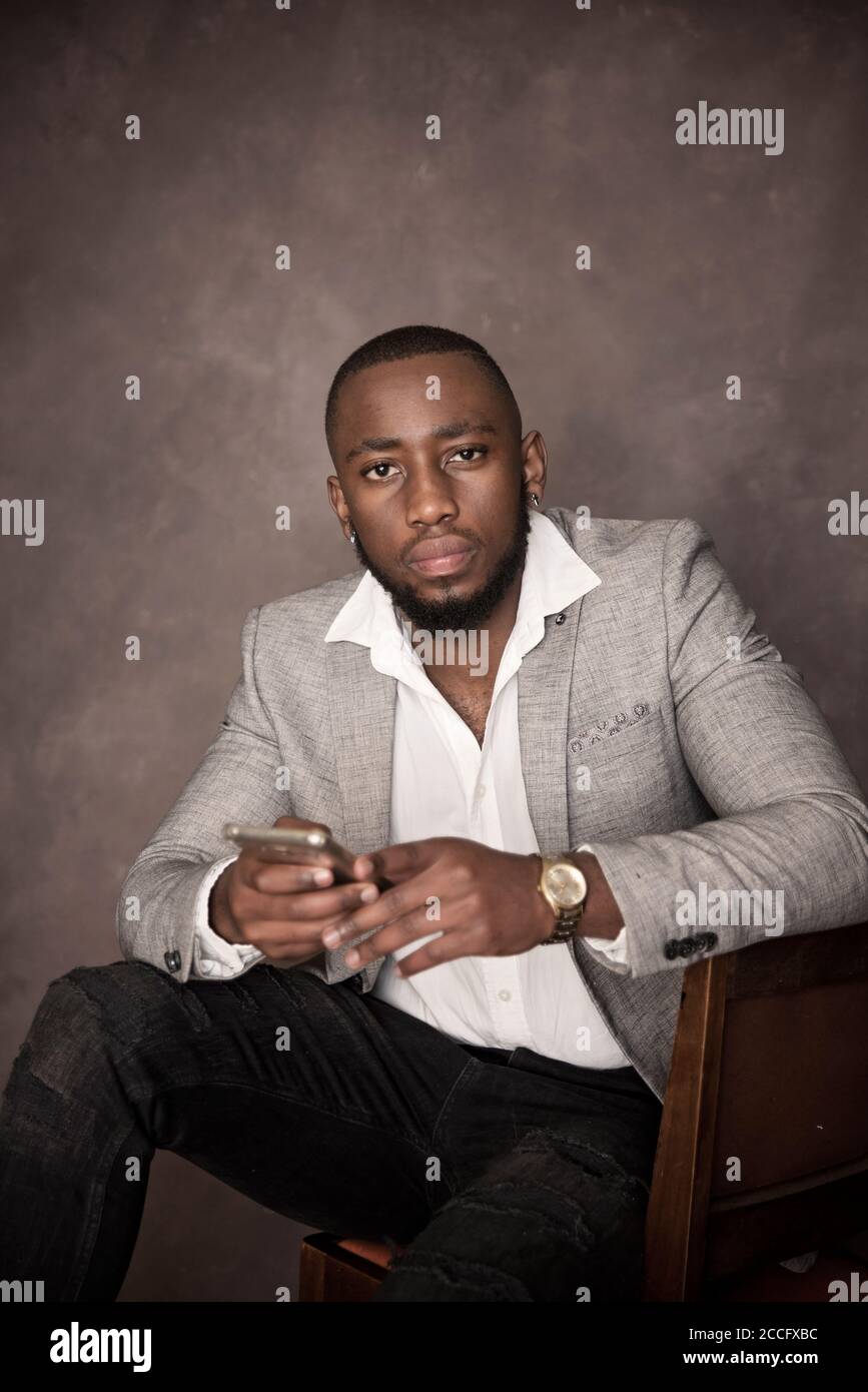 african stock photo of black gentlemen in smart clothes in studio ...
