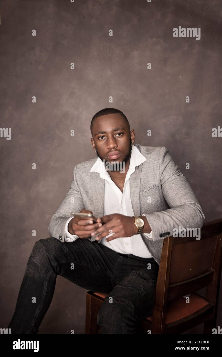 african stock photo of black gentlemen in smart clothes in studio ...