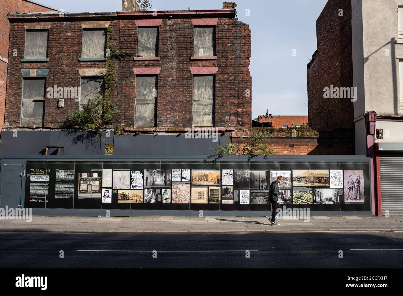Walking past dereliction Liverpool Stock Photo - Alamy