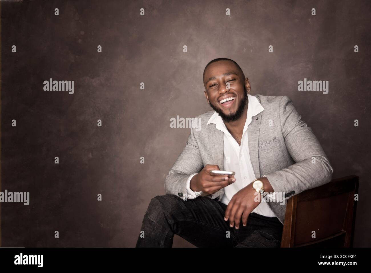 african stock photo of black gentlemen in smart clothes in studio ...