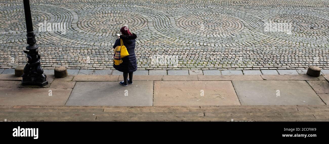 Lady checking phone Liverpool Stock Photo - Alamy