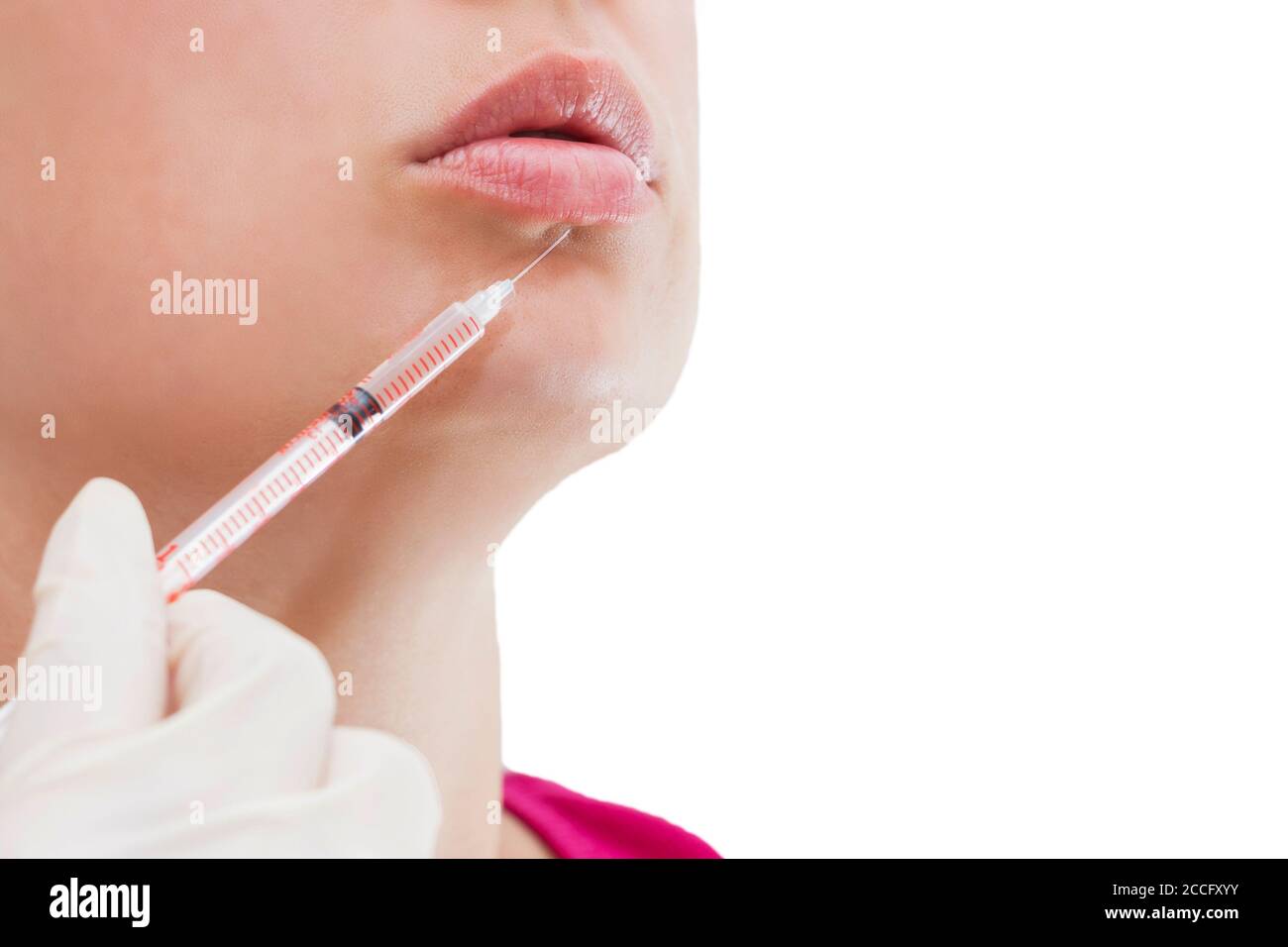 young woman gets injection in her lips. Woman in beauty salon. plastic ...