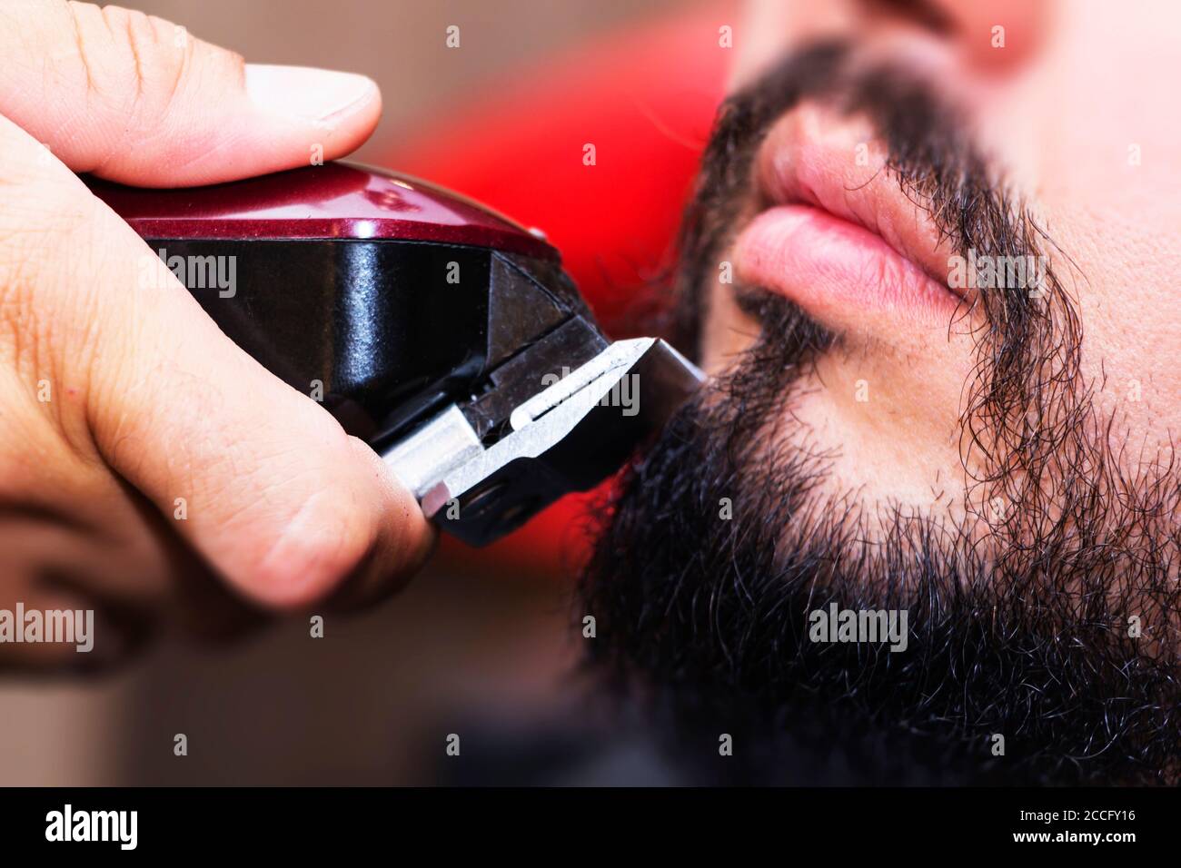 Beard styling and cut. Close up cropped photo of a styling of a red ...