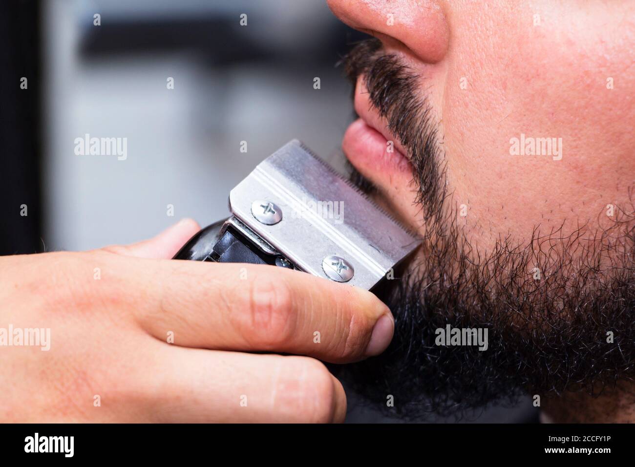 Beard styling and cut. Close up cropped photo of a styling of a red ...