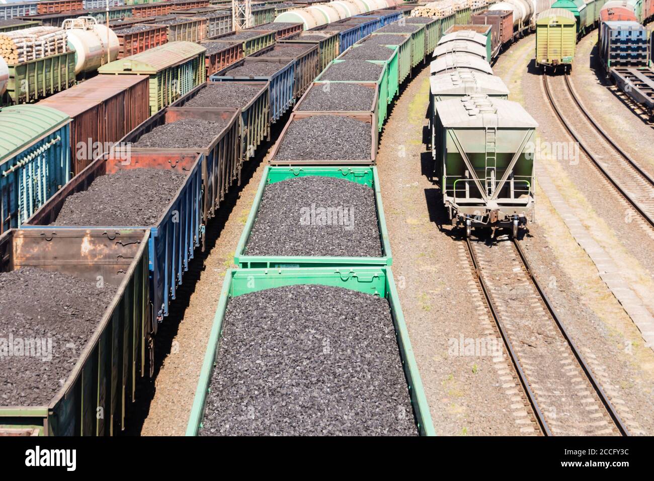 rail cars loaded with coal, a train transports coal Stock Photo - Alamy