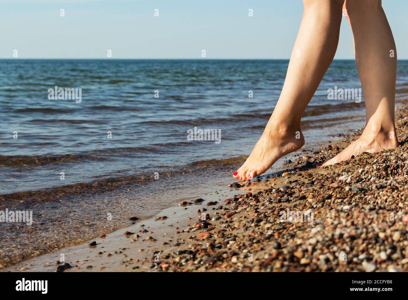 Human feet on the beach in summer hi-res stock photography and images ...