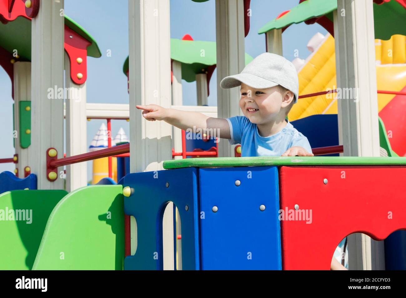 The child on the Playground points into the distance Stock Photo - Alamy