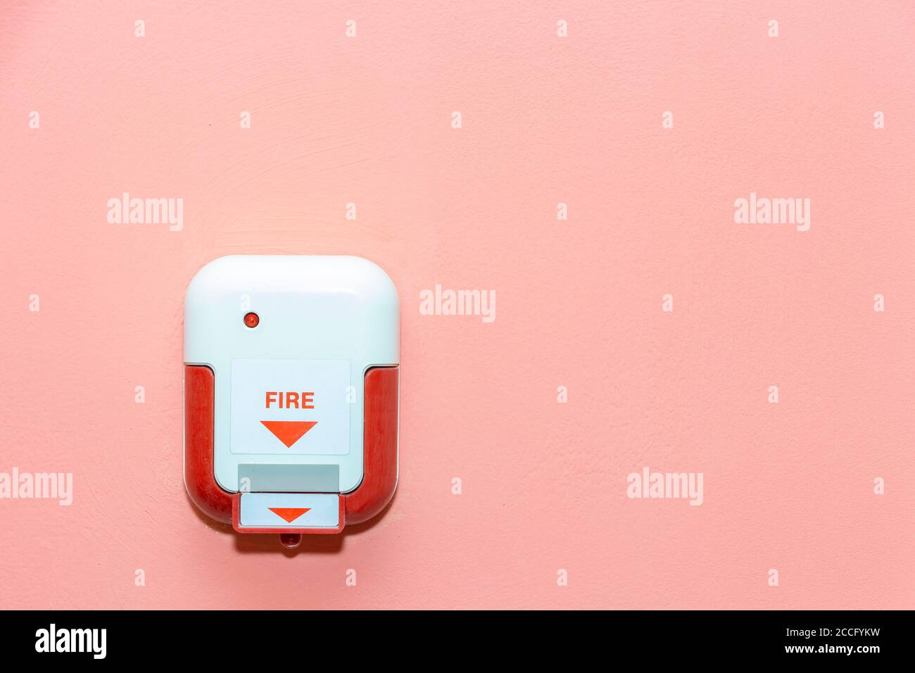 fire alarm box on pink wall for alarm and security system Stock Photo ...