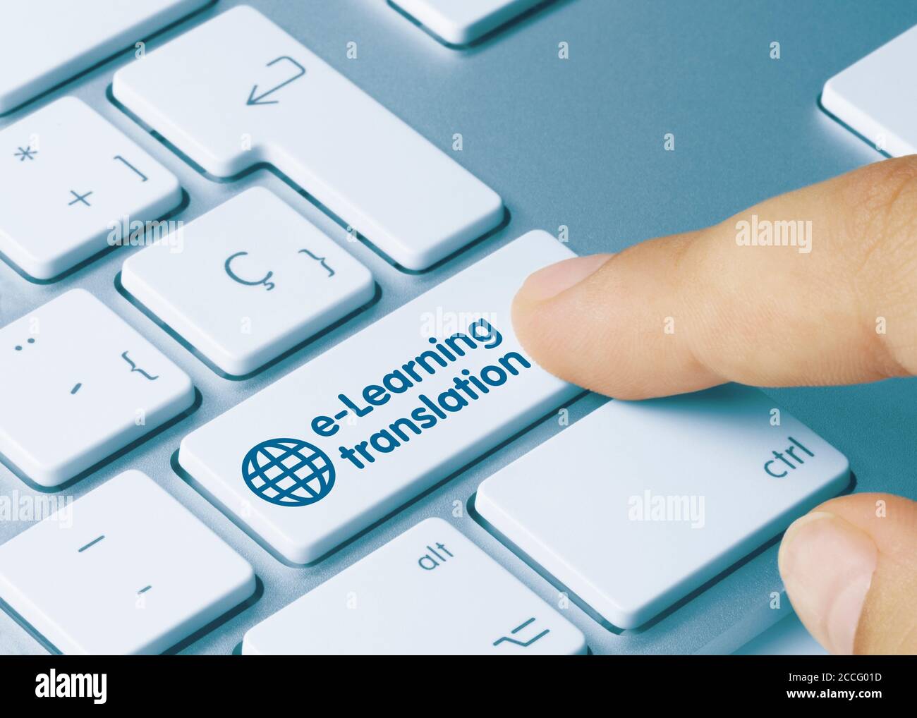 eLearning translation Written on Blue Key of Metallic Keyboard. Finger ...