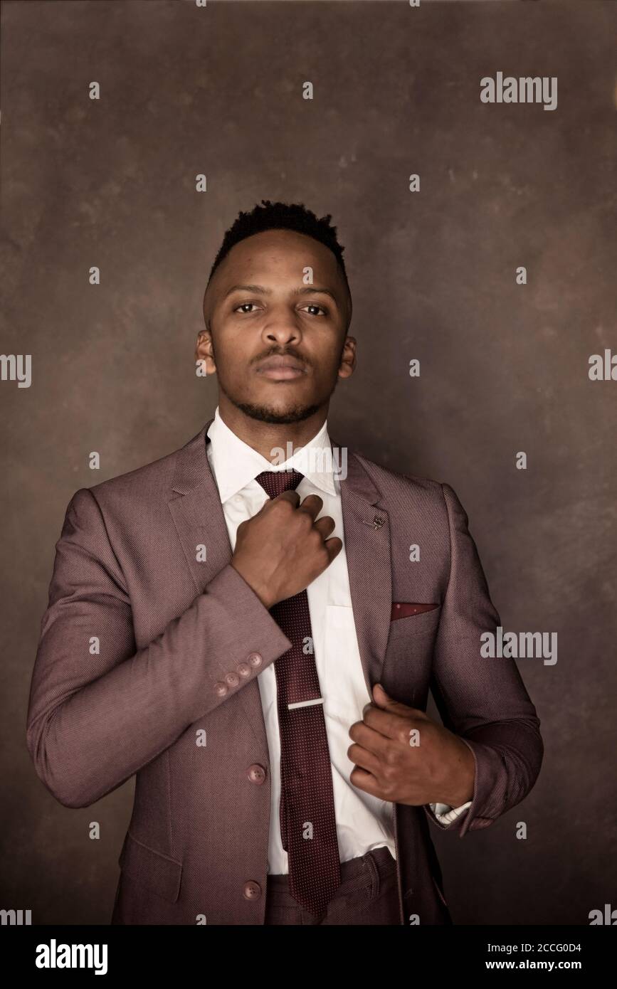 african stock photo of black gentlemen in smart clothes in studio ...