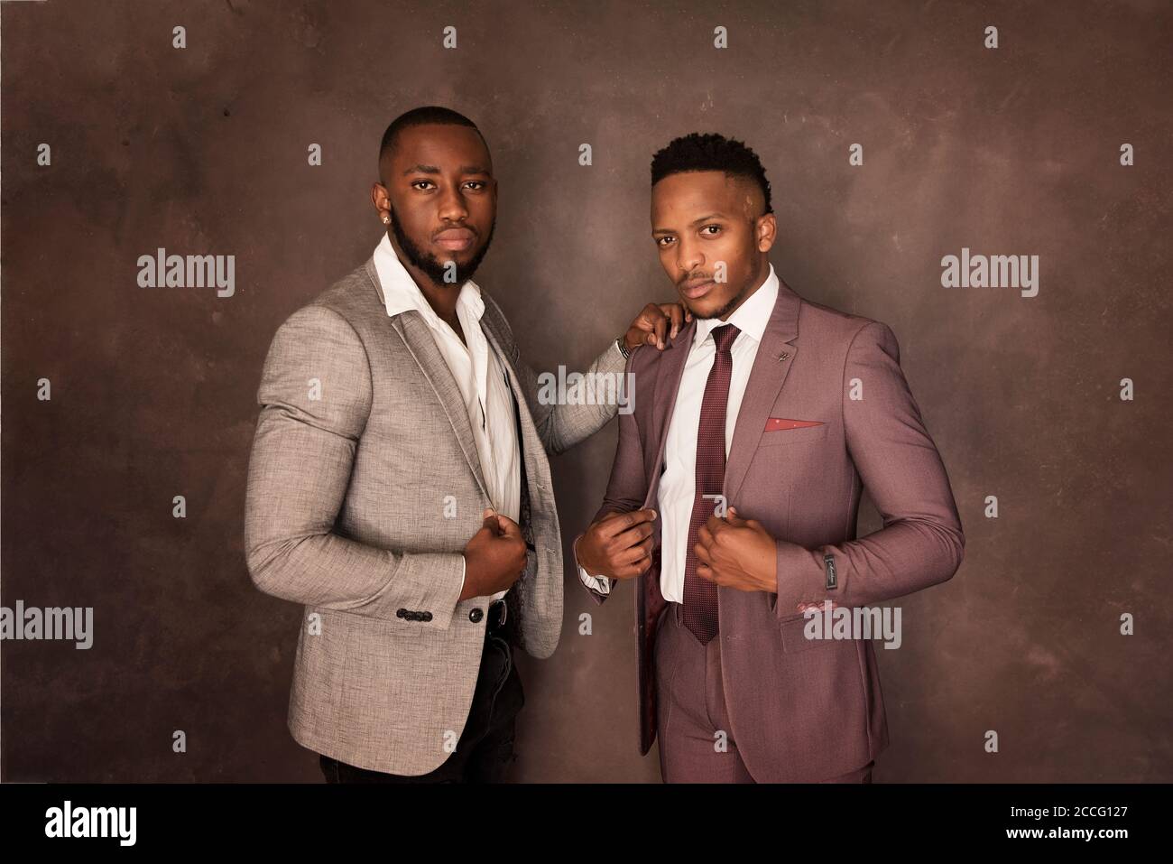 african stock photo of black gentlemen in smart clothes in studio ...