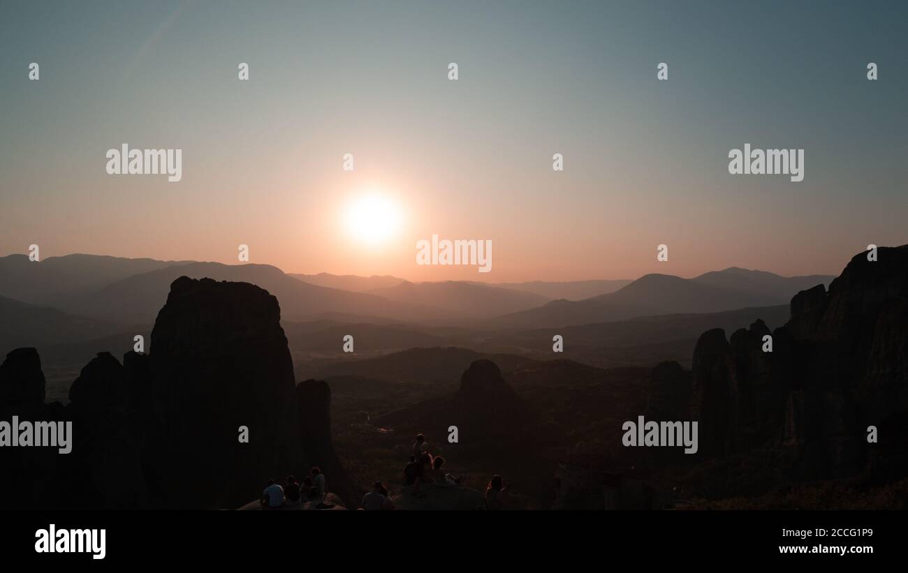 Meteora, a vast complex of giant rock pillars with monasteries. Sunset ...