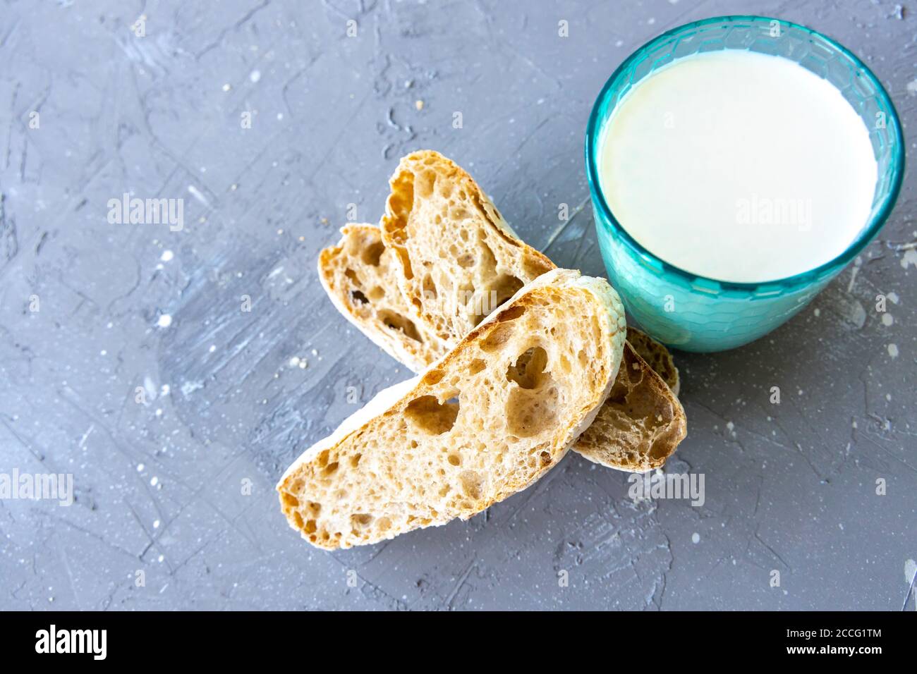 Bread and milk in blue glass. top view Stock Photo - Alamy